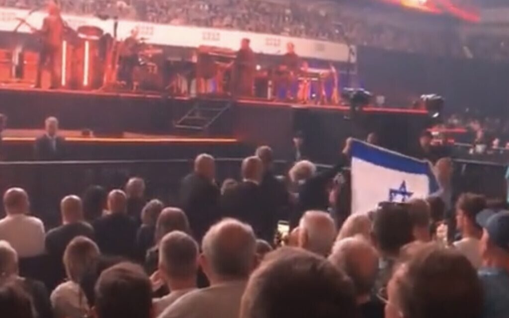 Protester crashes stage of Roger Waters concert with Israeli flag ...